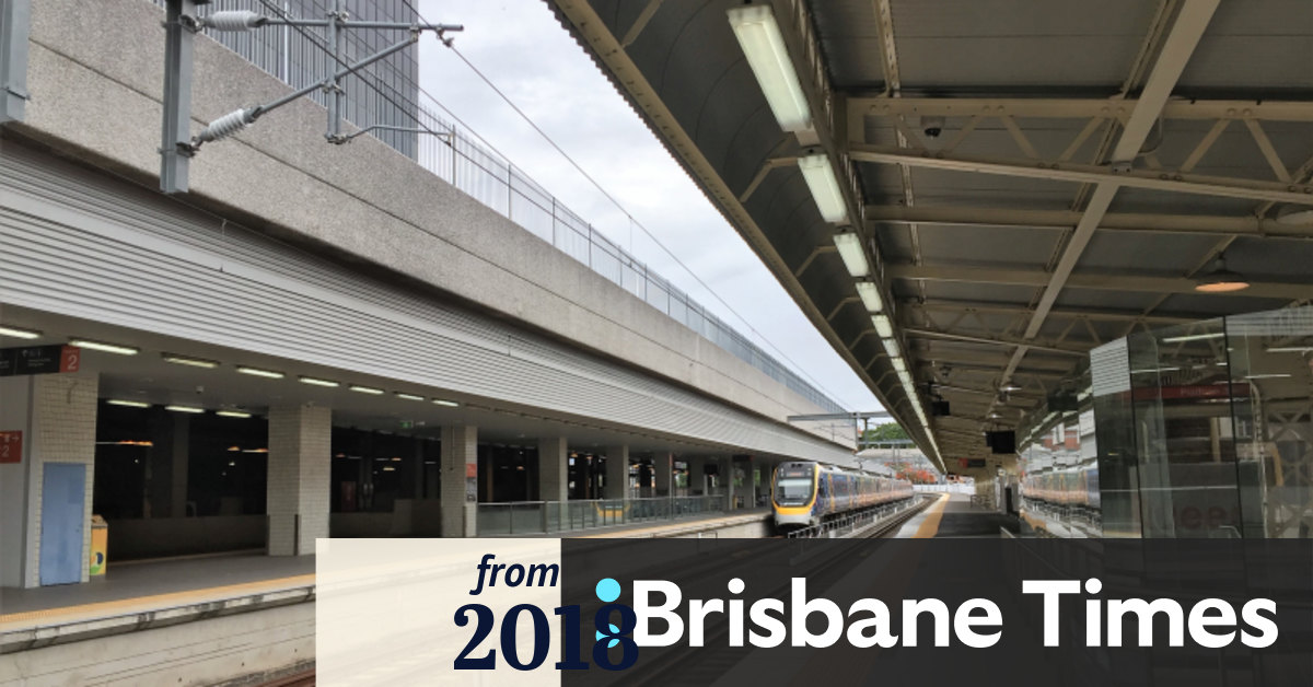 Woman falls onto train tracks at Roma Street station